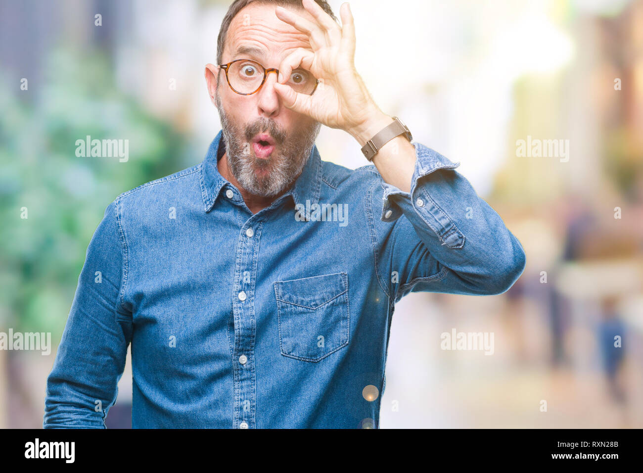 Middle age hoary senior man wearing glasses over isolated background ...