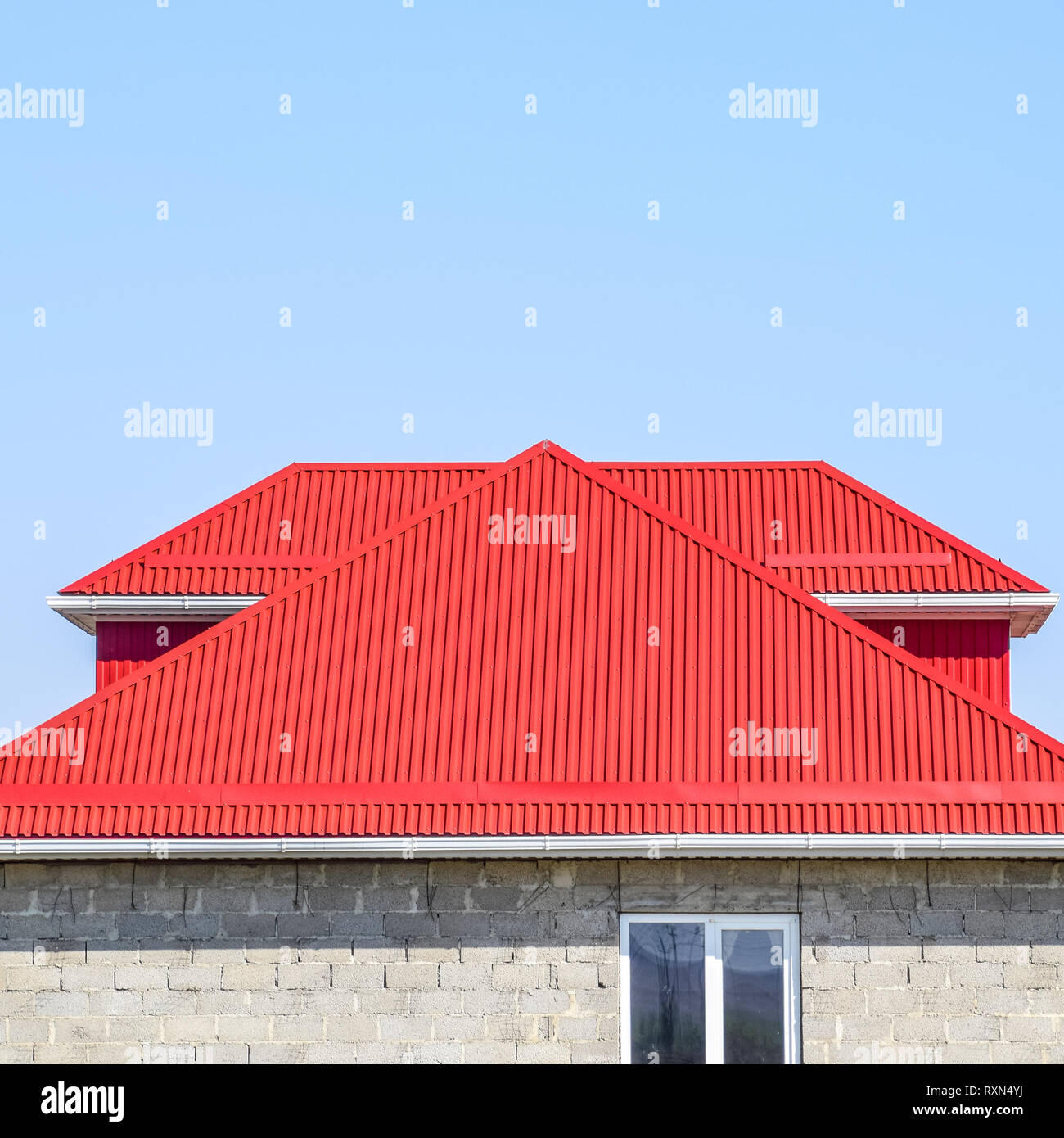 Red corrugated roof. House of cinder block. The house with plastic ...