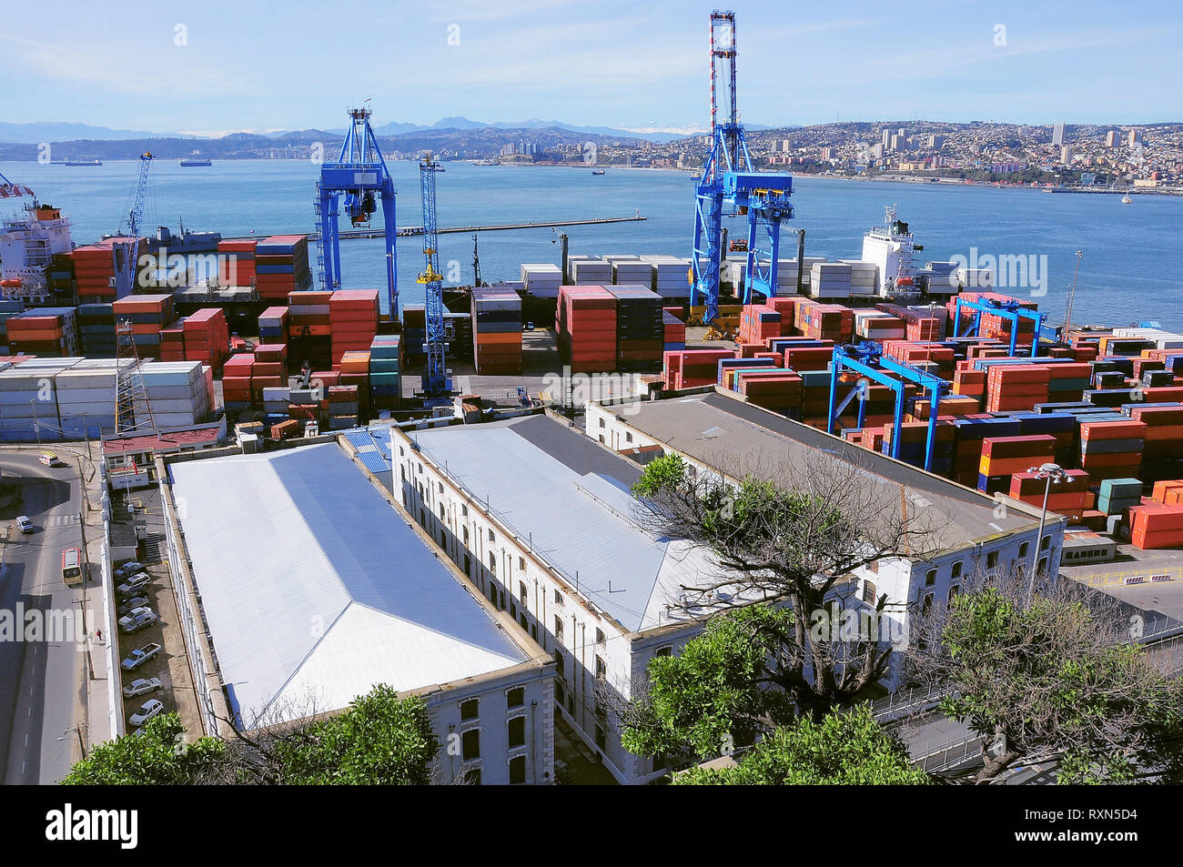 Loading of the container vessel in the city port. Valparaiso, Chile ...