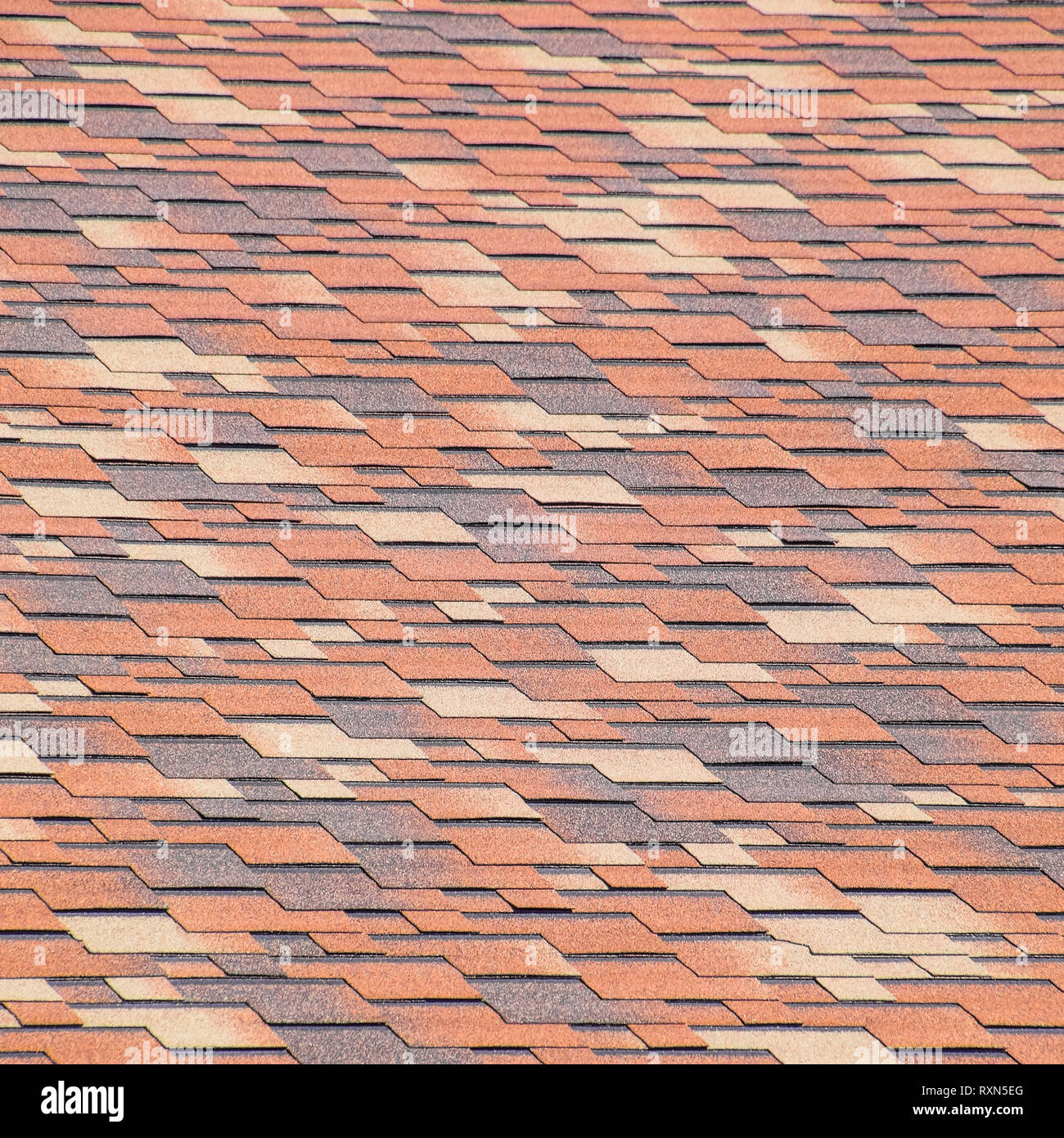 Roof from multi-colored bituminous shingles. Patterned bitumen shingles ...