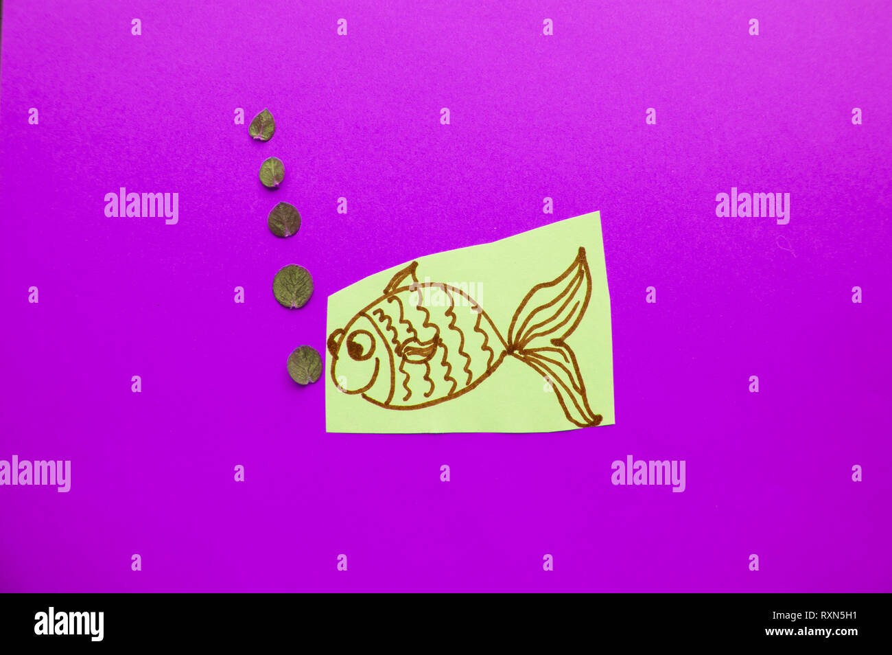 Funny fish with bubbles on purple background, fool's Day Stock Photo ...