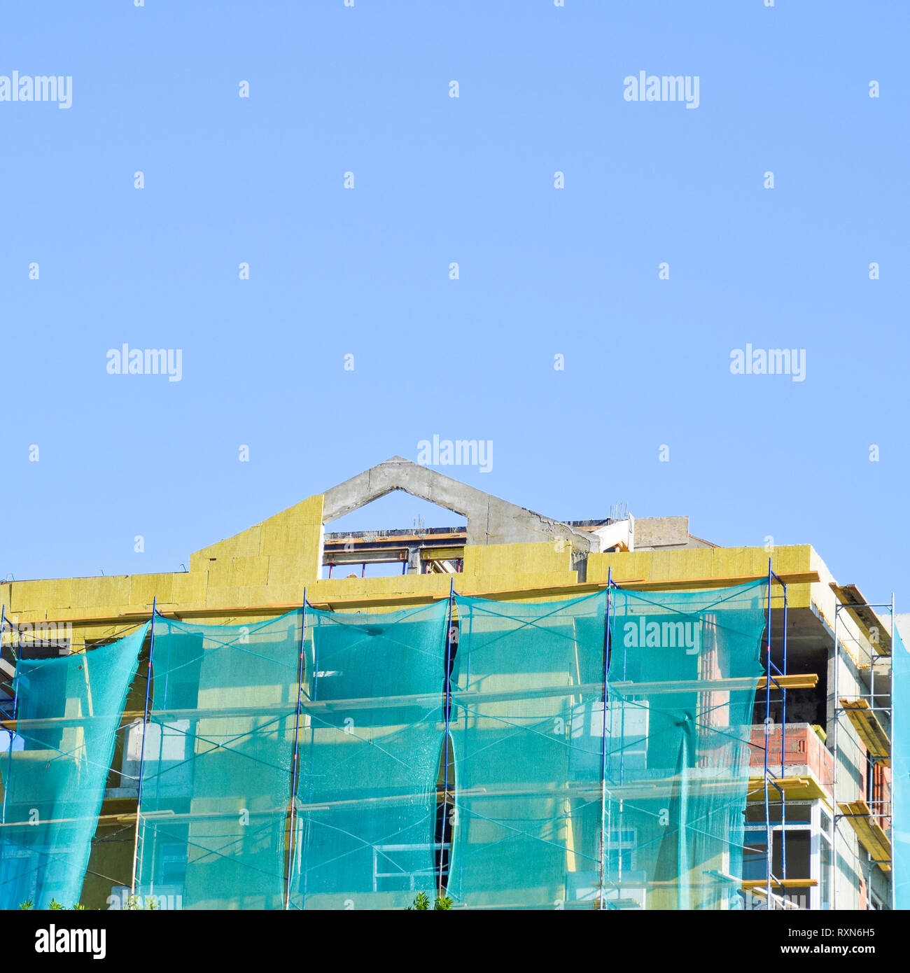 Safety net in the newly built high-rise building. Green grid on ...