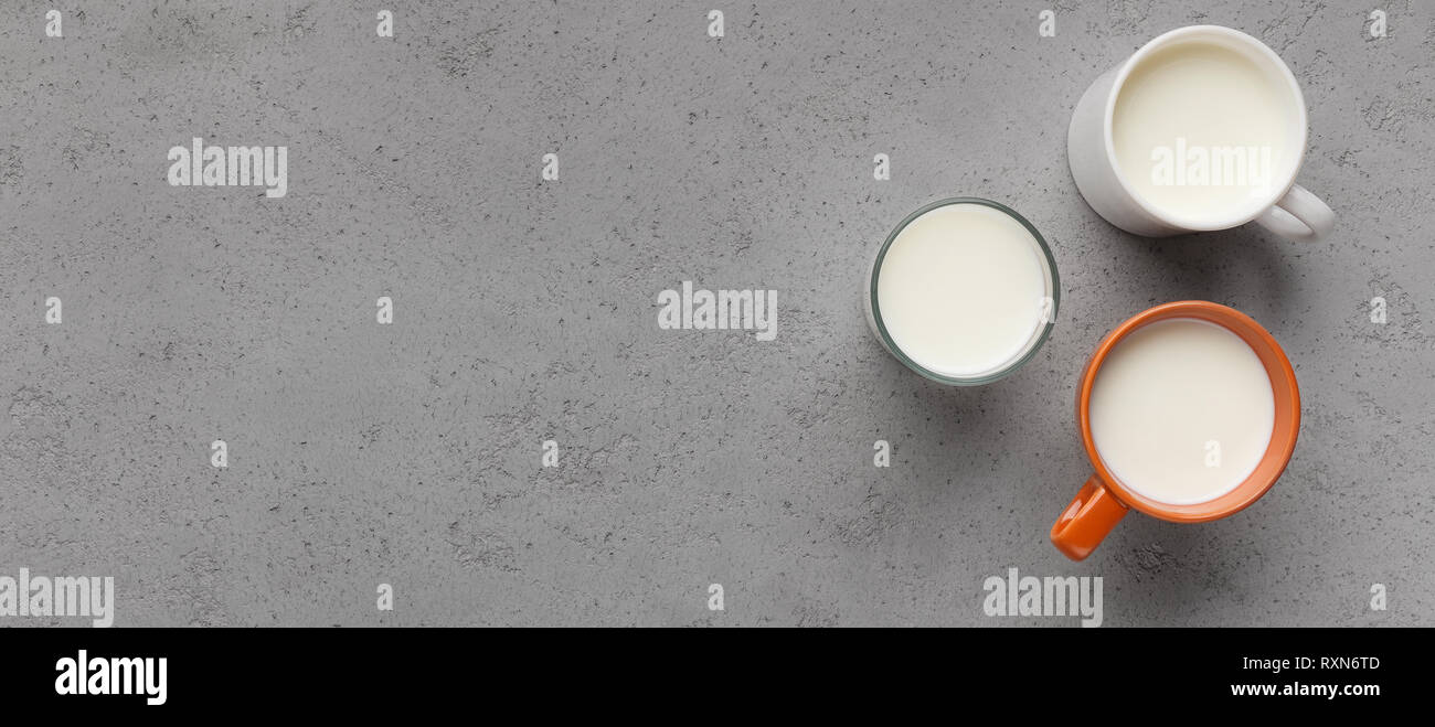 Fresh milk in three cups Stock Photo - Alamy