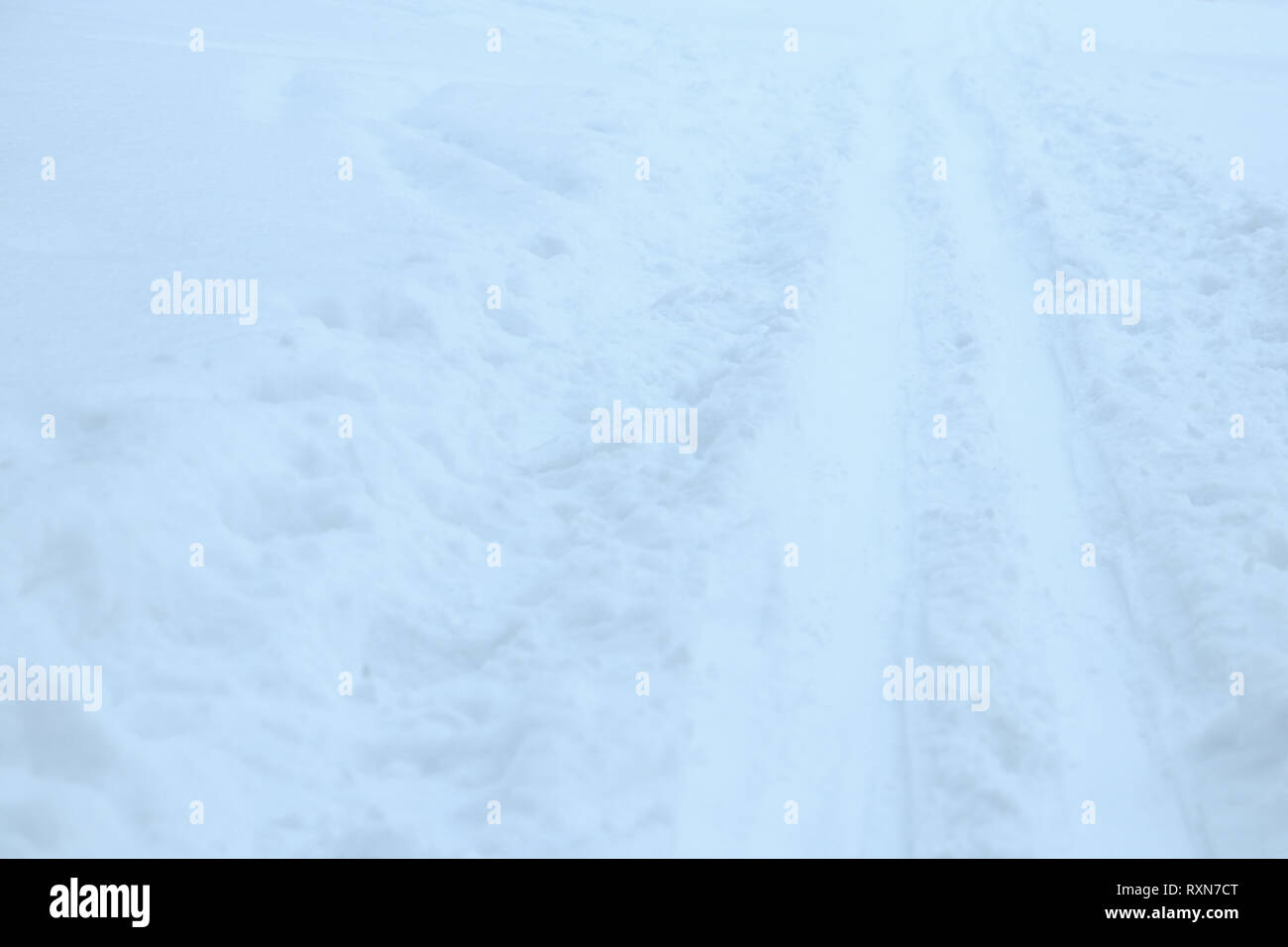 Ski track on the snow background. Winter snowy texture. Fresh frozen ...