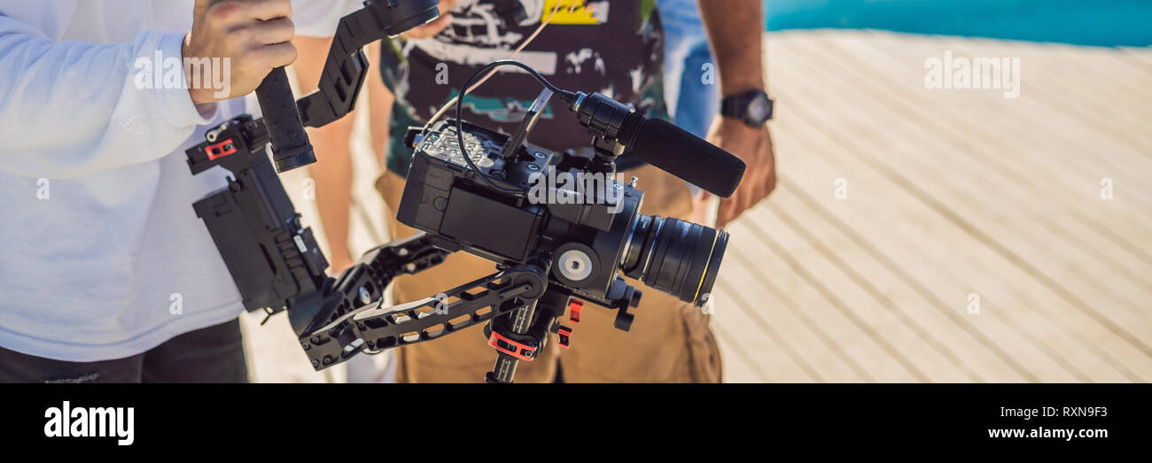Professional steadicam operator uses a 3-axis camera stabilizer system ...