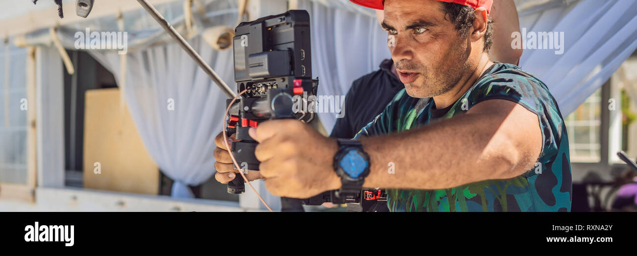 the production team on a commercial video shoot. Steadicam operator ...
