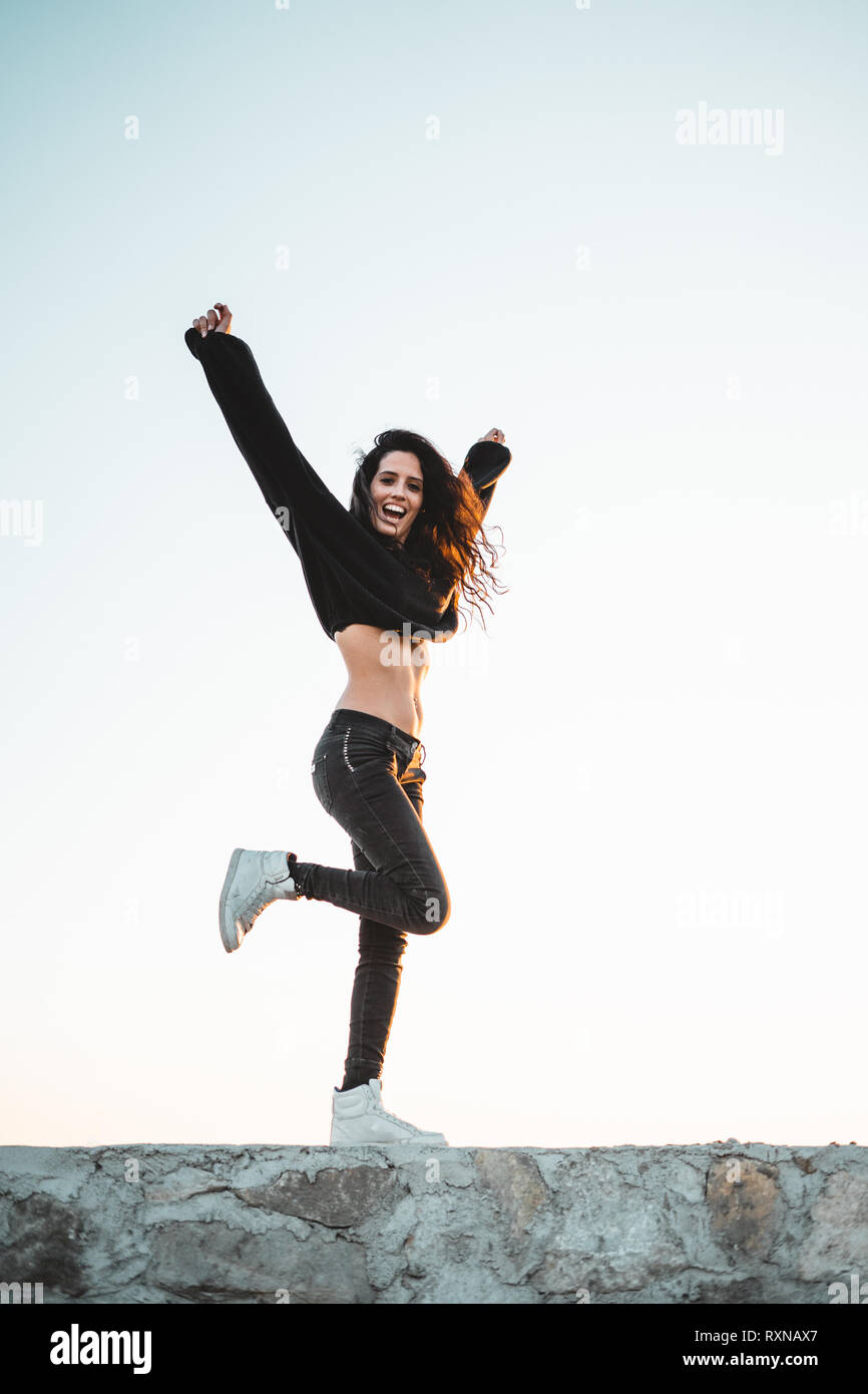 Lady jumping wall hi-res stock photography and images - Alamy