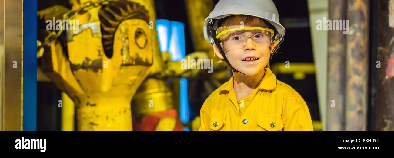 Boy operator recording operation of oil and gas process at oil and rig ...