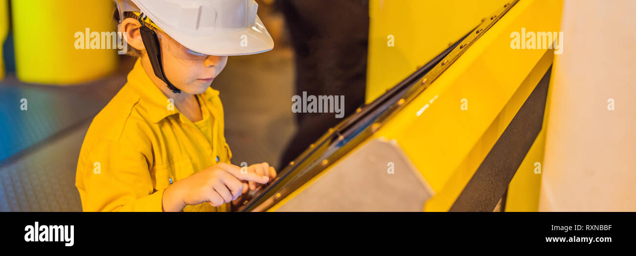 Boy operator recording operation of oil and gas process at oil and rig ...