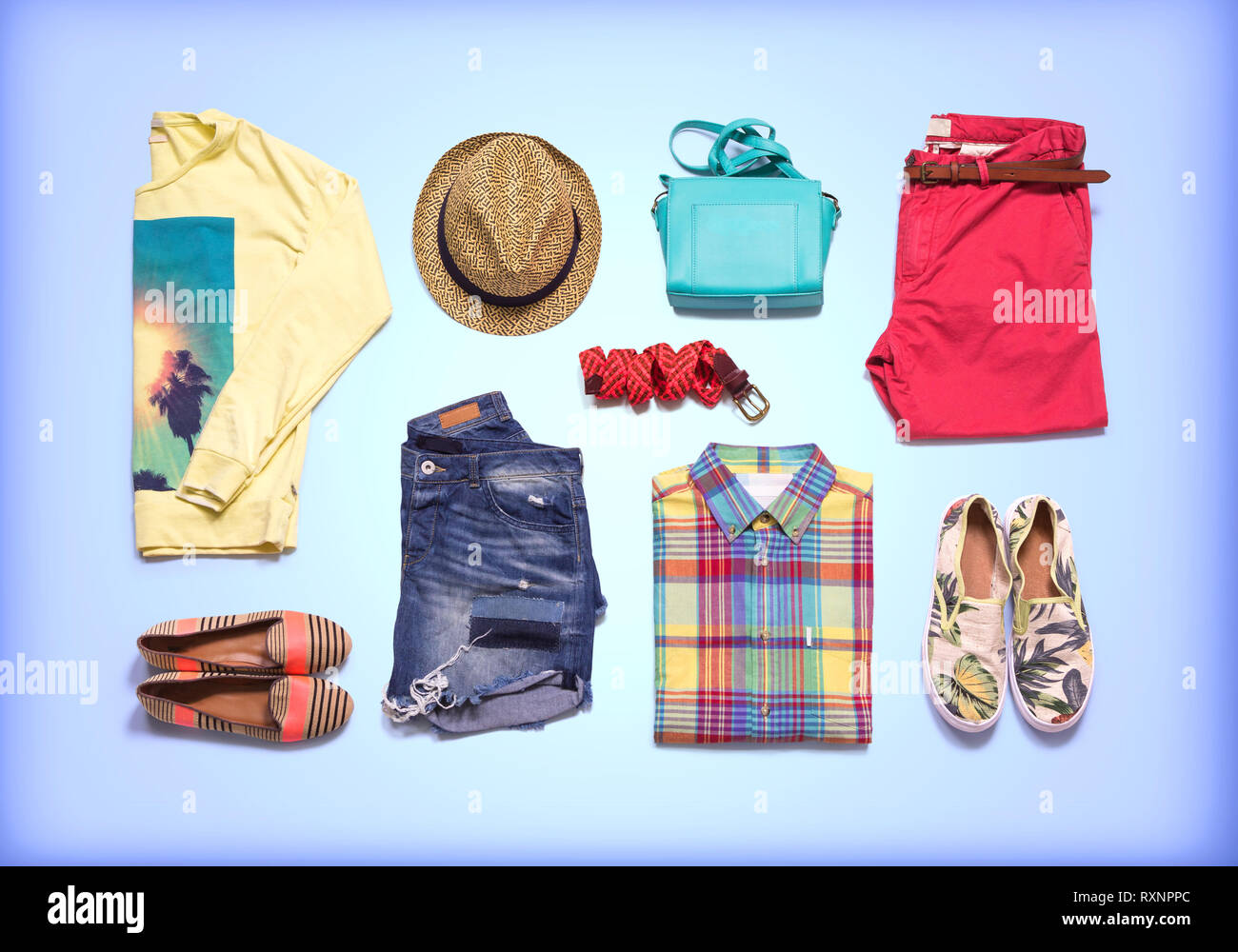 Clothes and accessories. Collection of summer clothes. Colorful folded ...