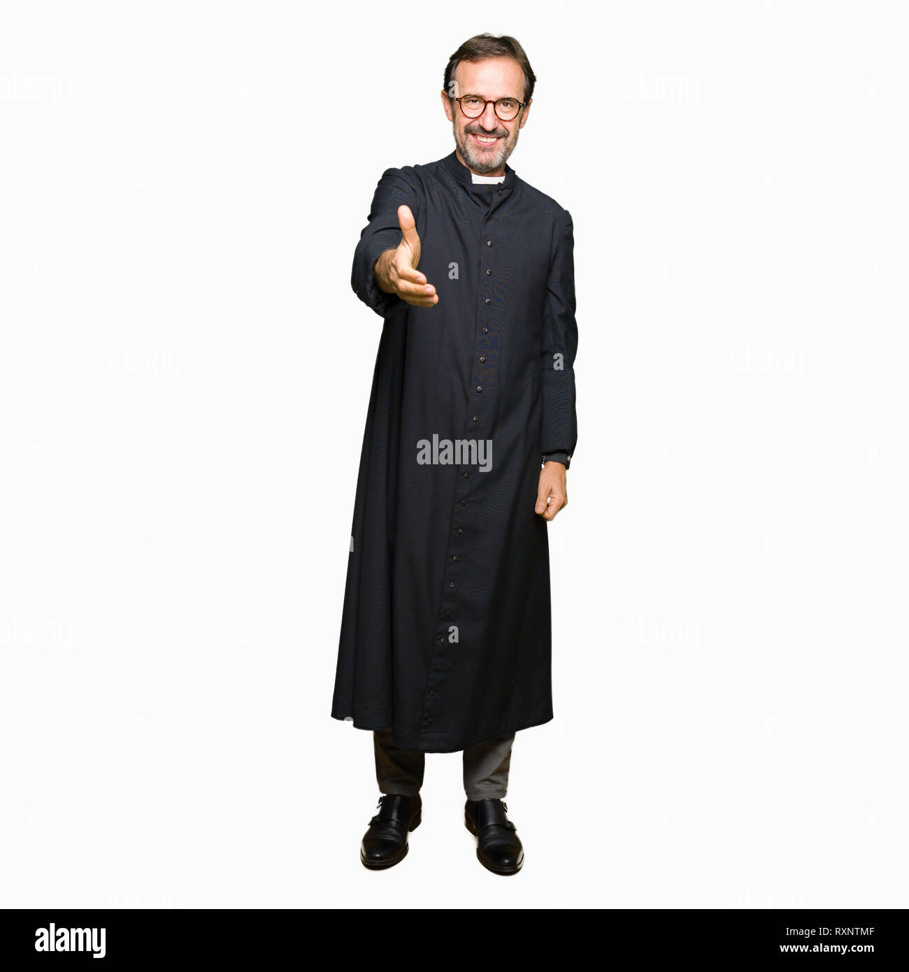 Priest catholic church shake hands hi-res stock photography and images ...