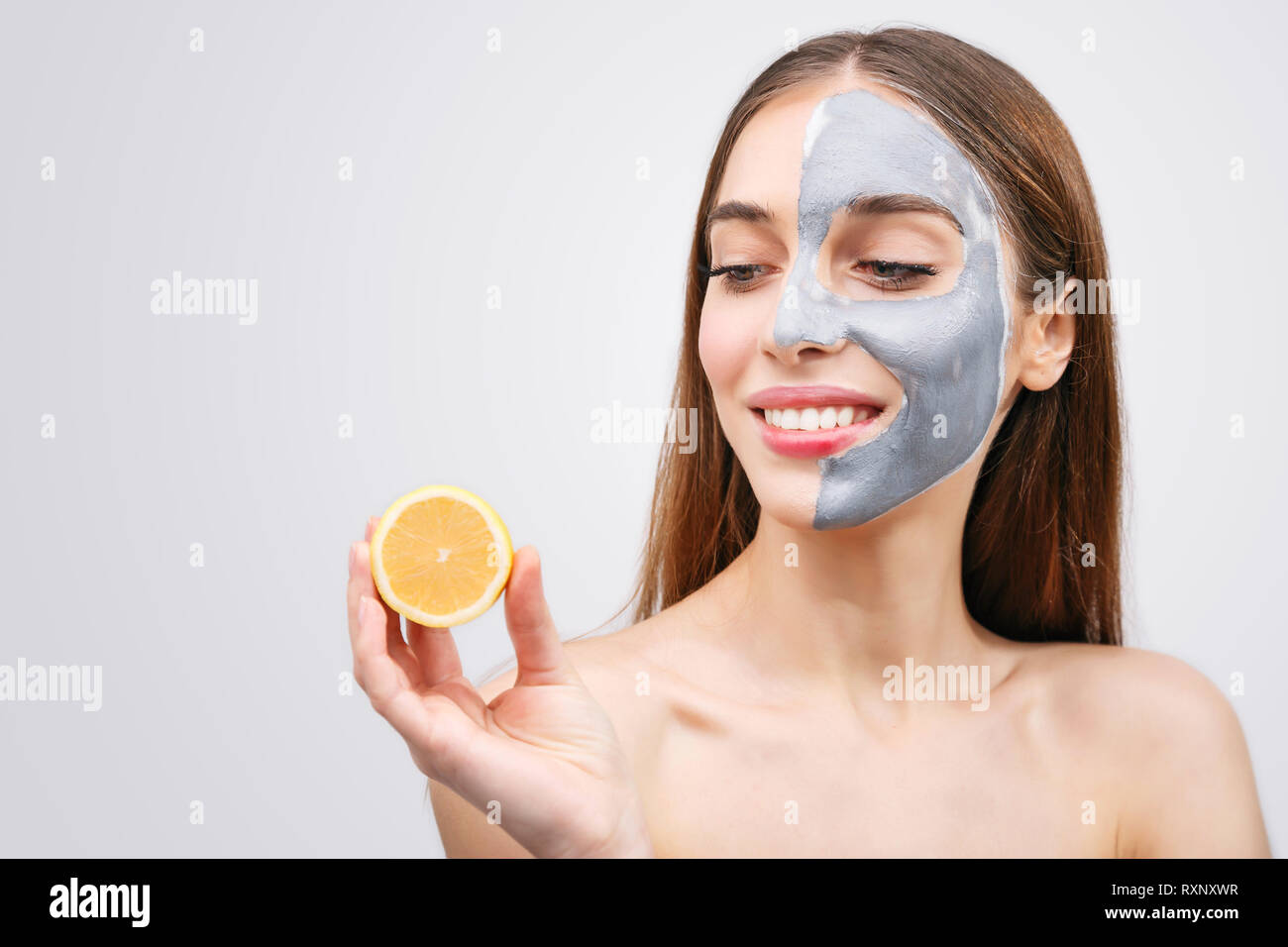 Close up portrait of young emotional beautiful woman with lemon in her ...