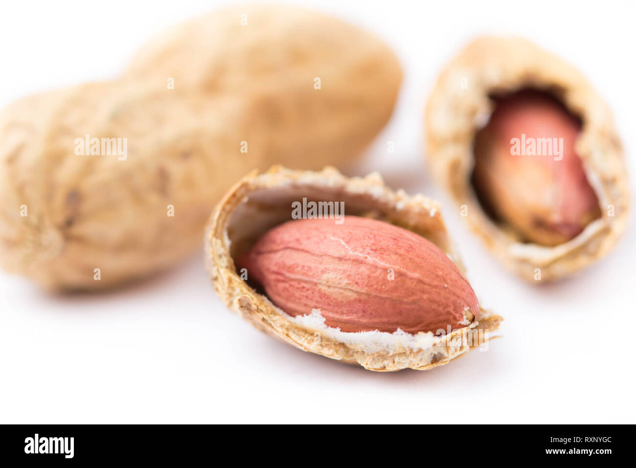 Close up of split peanuts in shell on white background. Healthy food ...