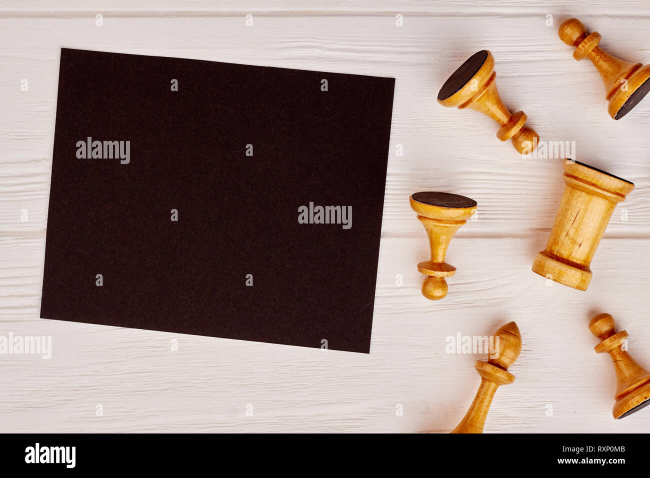 Wooden chess pieces and blank paper sheet Stock Photo - Alamy