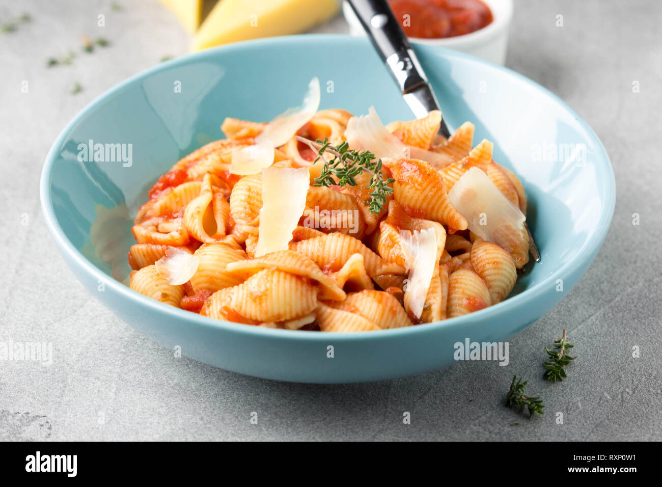 Pasta conchiglioni (conchiglie, shells) with tomato sauce, Parmesan ...