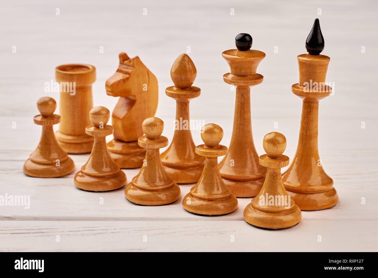 Group of brown wooden chess pieces Stock Photo - Alamy