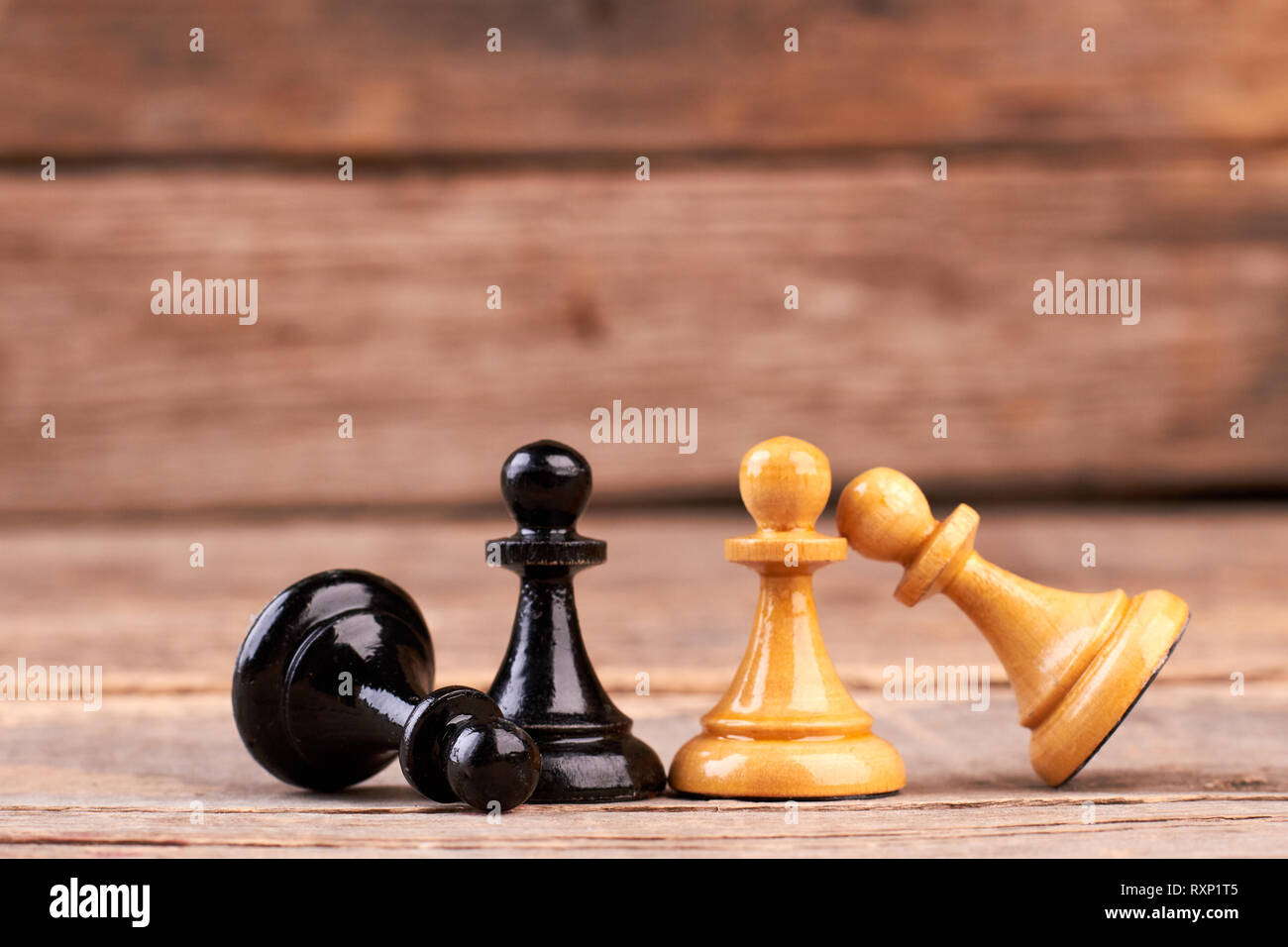 Four wooden pawn chess pieces Stock Photo - Alamy