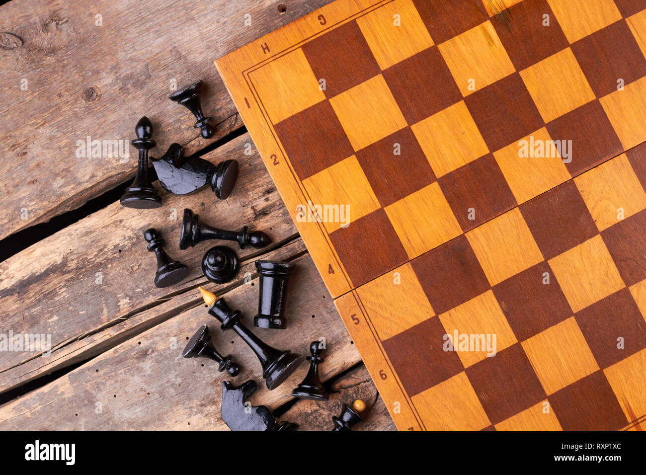Brown chess board and black chess figures Stock Photo - Alamy