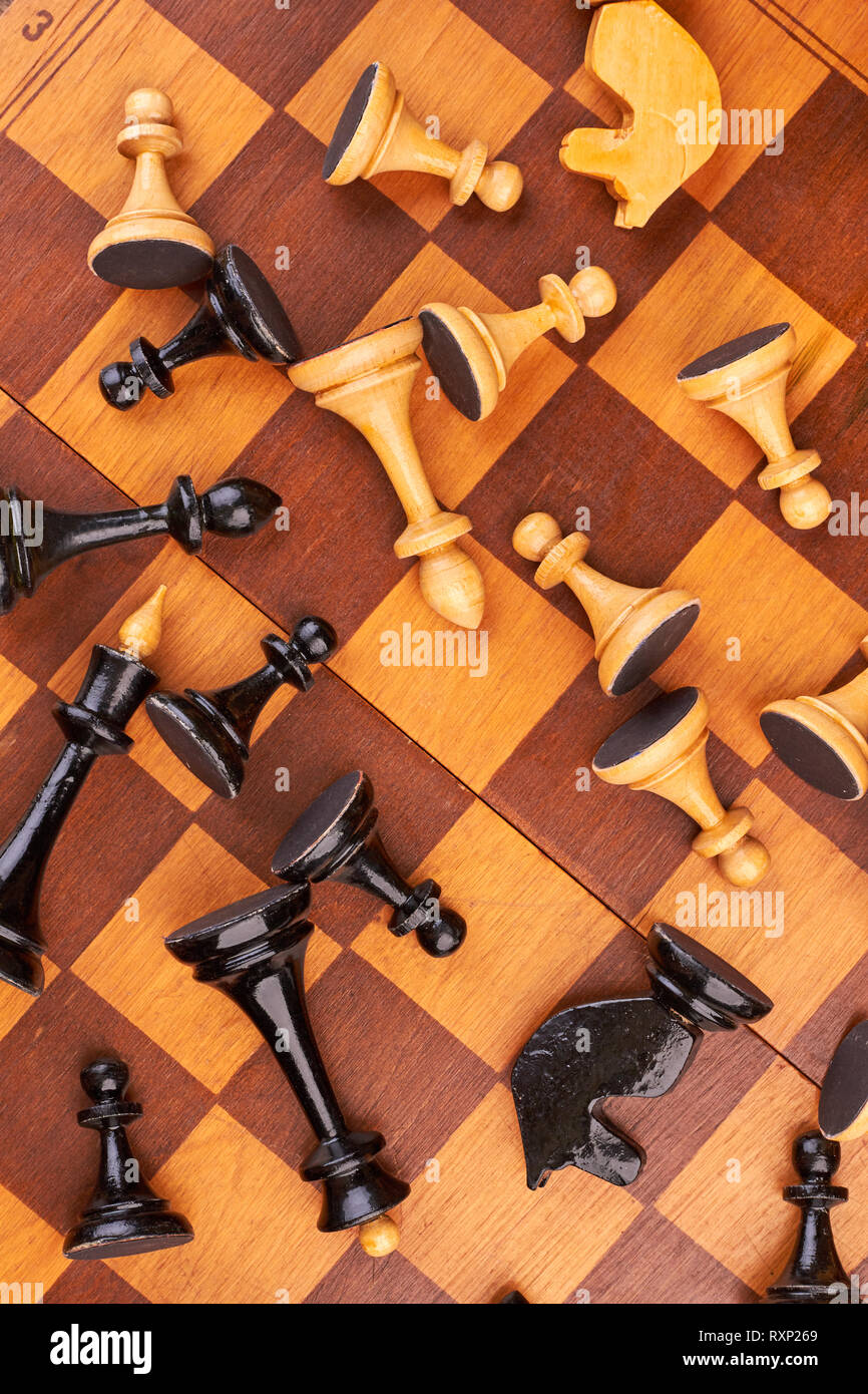 Group of chess pieces on chess board, top view Stock Photo - Alamy