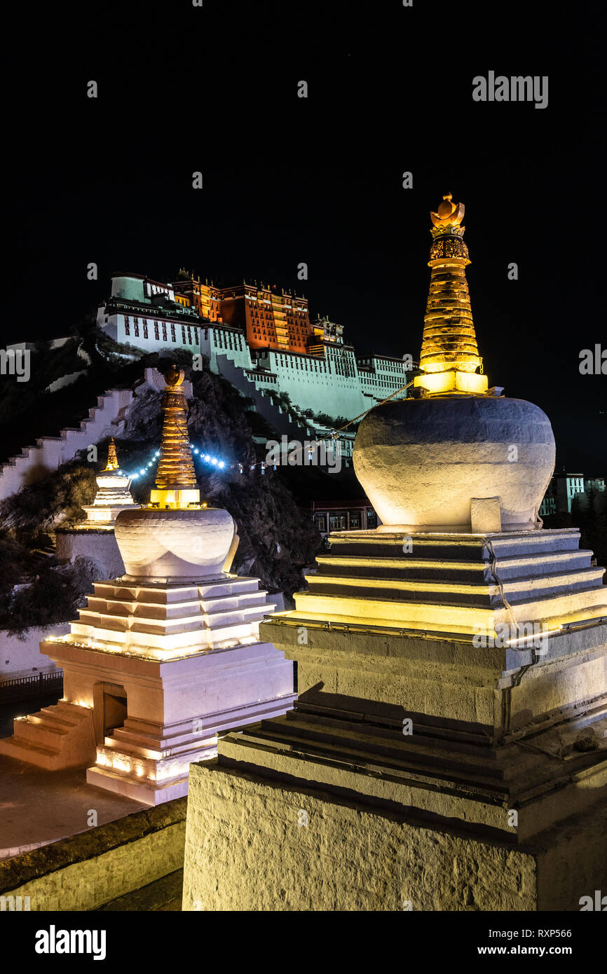 Night view of the illuminated Potala palace in Lhasa old town in Tibet ...