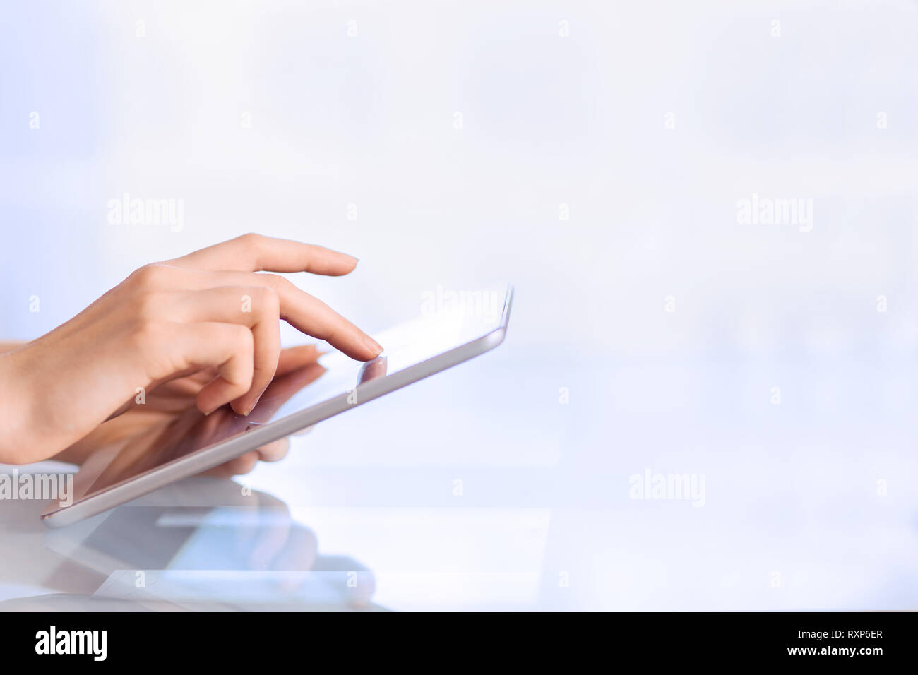 Female hand holding business digital tablet touching screen display by ...