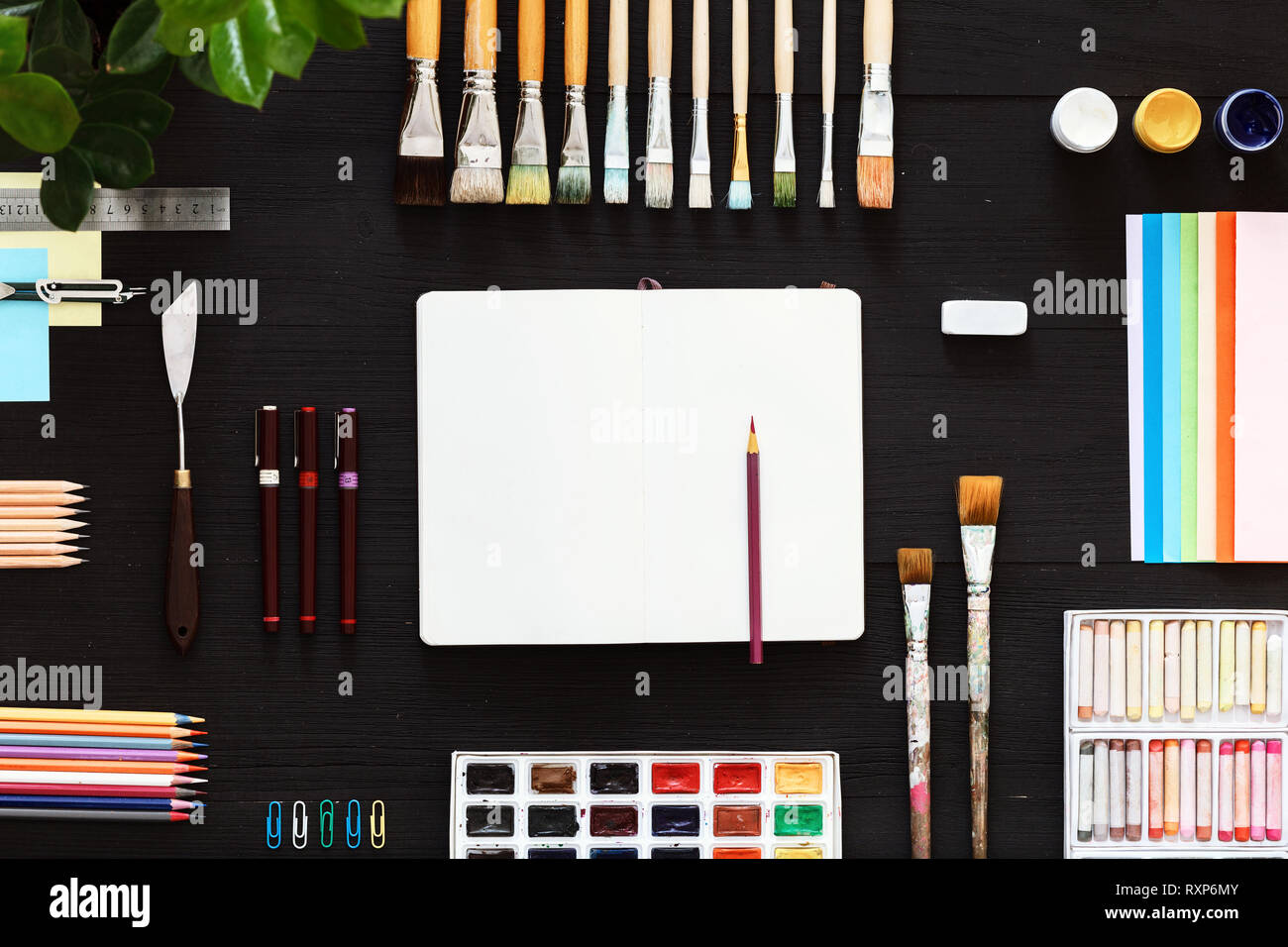 Creative art work table concept, mock up blank notebook sketchbook ...