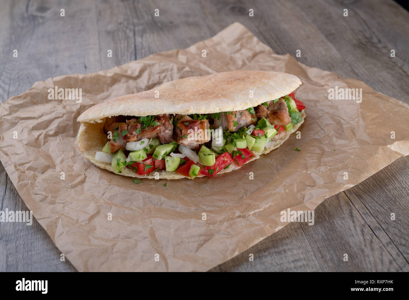 A traditional dish from cyprus. Pork kebab is grilled on charcoals and ...