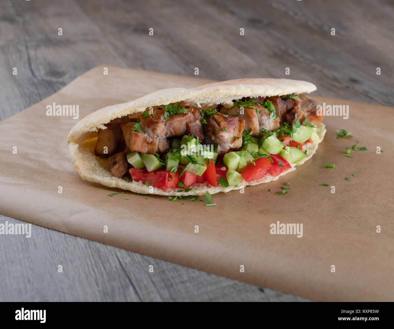 A traditional dish from cyprus. Pork kebab is grilled on charcoals and ...