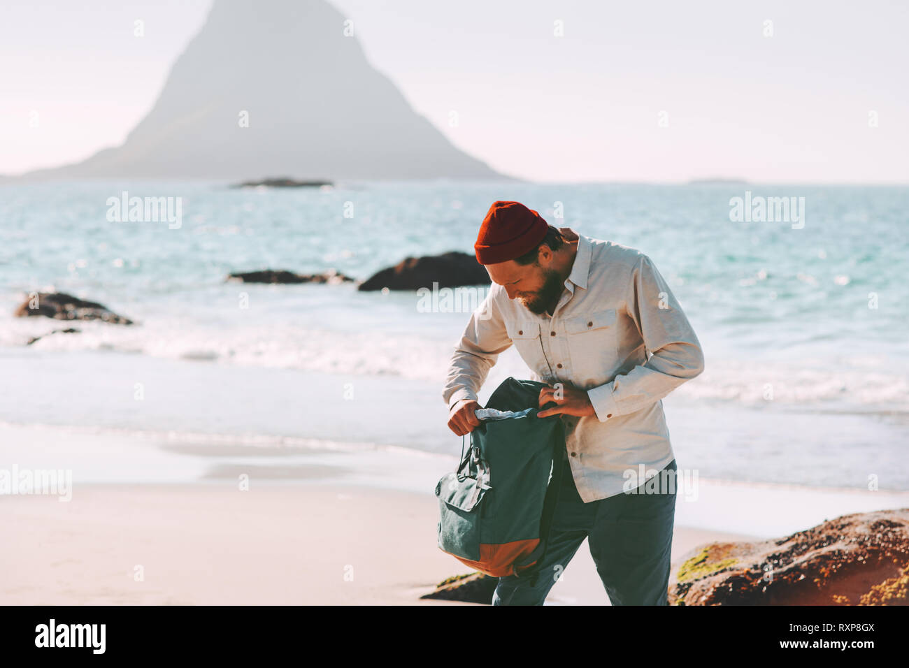 Man packing backpack sea hi-res stock photography and images - Alamy