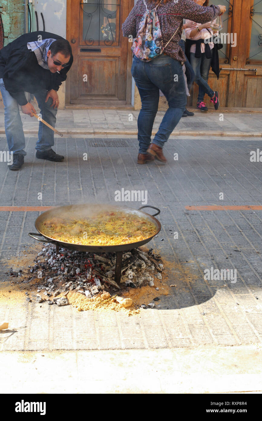 People cooking paella on the street in Valencia during the Fallas ...