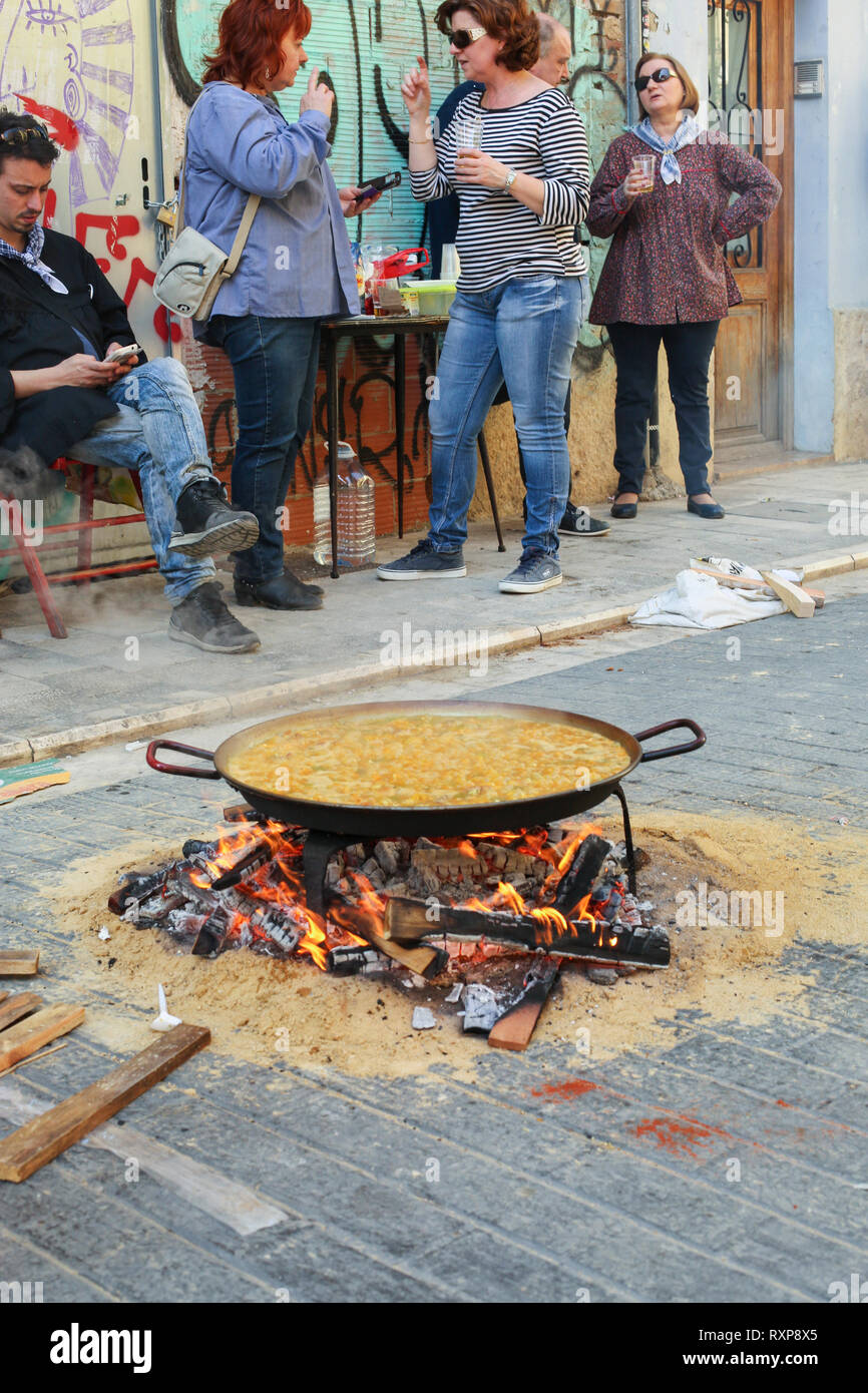 People cooking paella on the street in Valencia during the Fallas ...