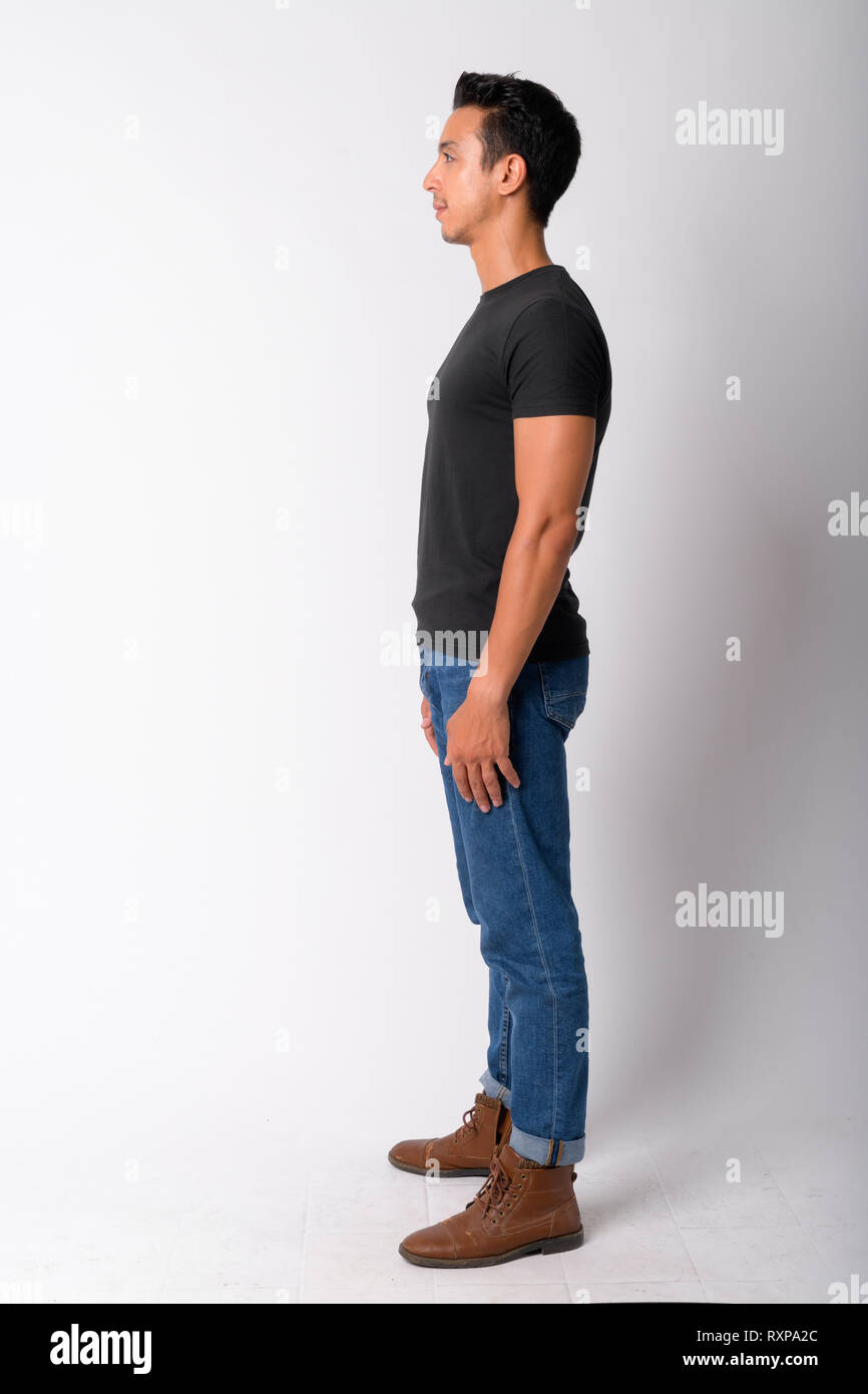 Full body shot profile view of handsome Hispanic man Stock Photo - Alamy