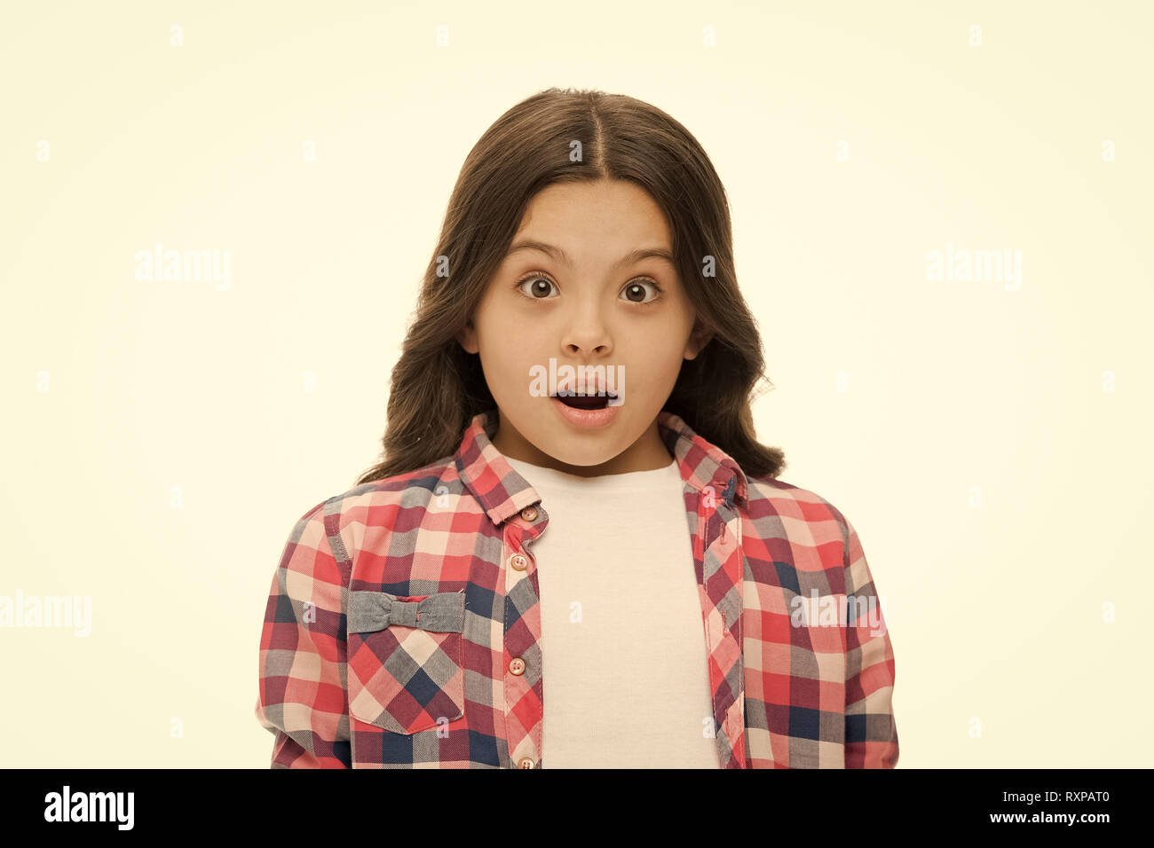 Kid with shocked look isolated on white. Girl with long brunette hair ...