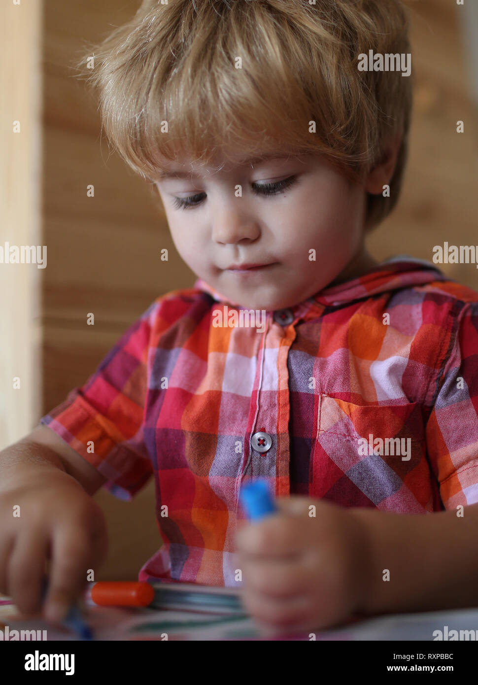 Small boy child drawing with colorful marker pen Stock Photo - Alamy