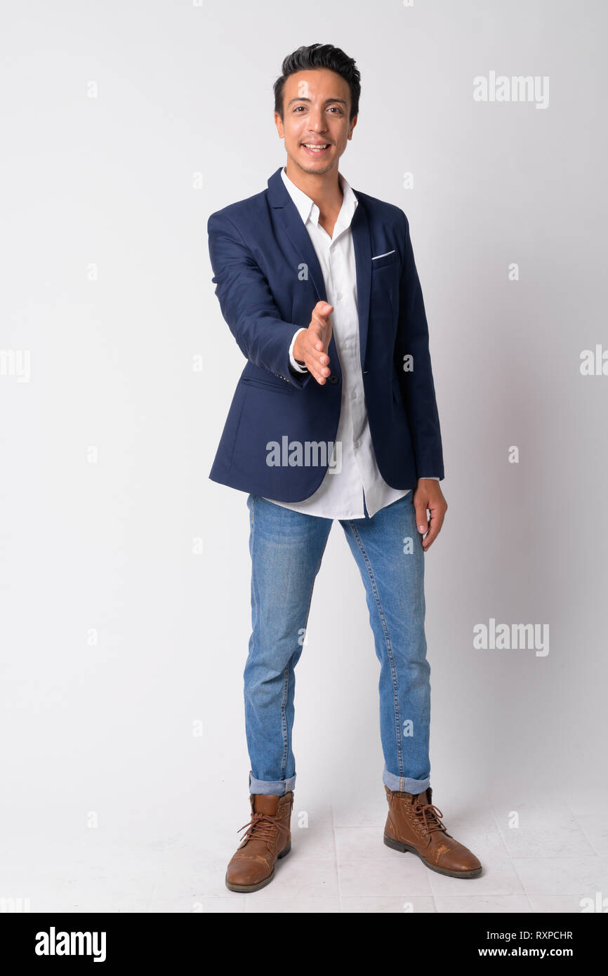 Full body shot of happy Hispanic businessman giving handshake Stock ...