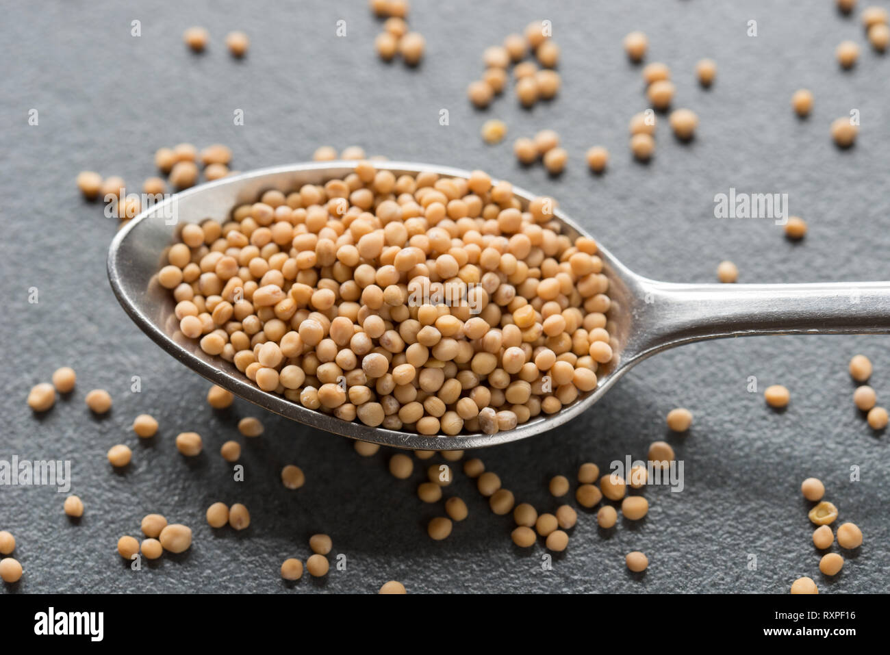 Yellow mustard seeds texture background hi-res stock photography and ...