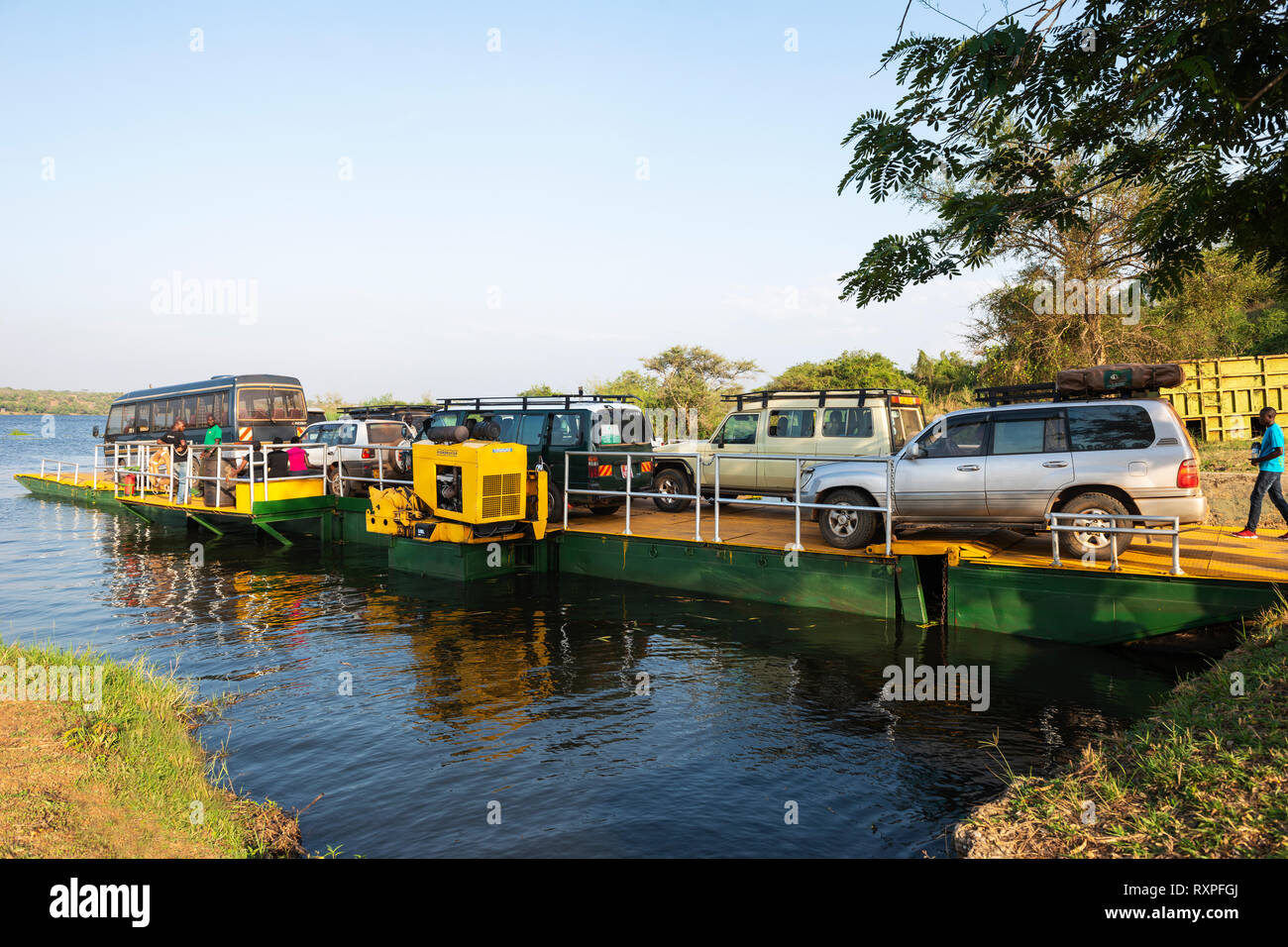 Loading ferry transporting vehicles and people across the Victoria Nile ...