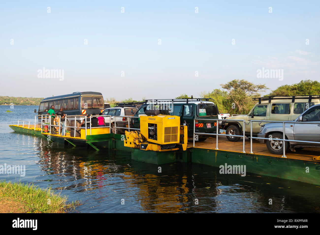 Loading ferry transporting vehicles and people across the Victoria Nile ...