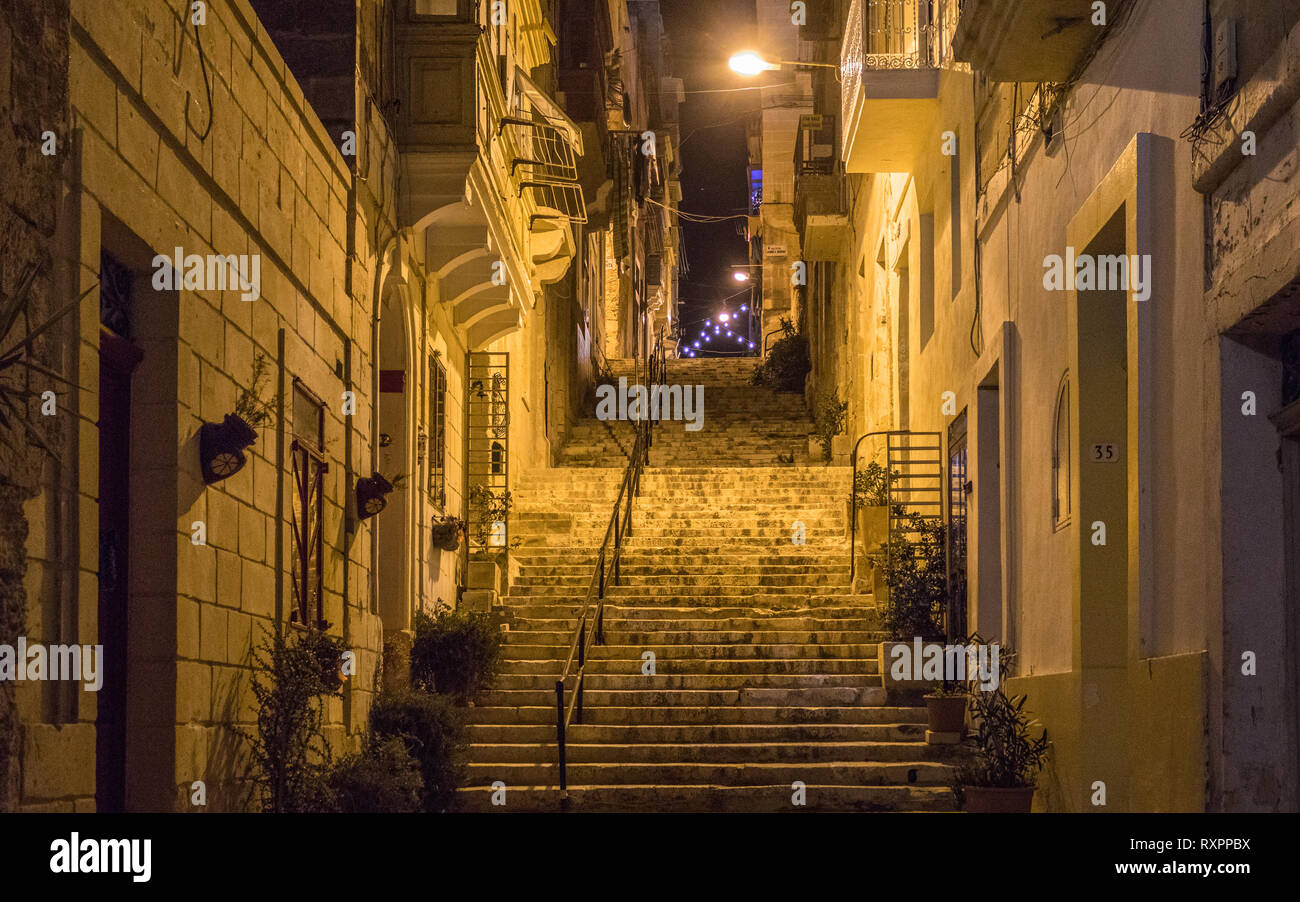 Steps and buildings at night in birgu hi-res stock photography and ...