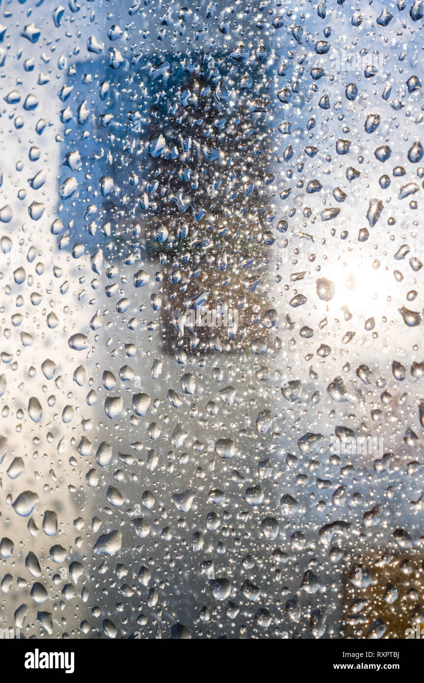 background of raindrops on window glass, close-up Stock Photo - Alamy