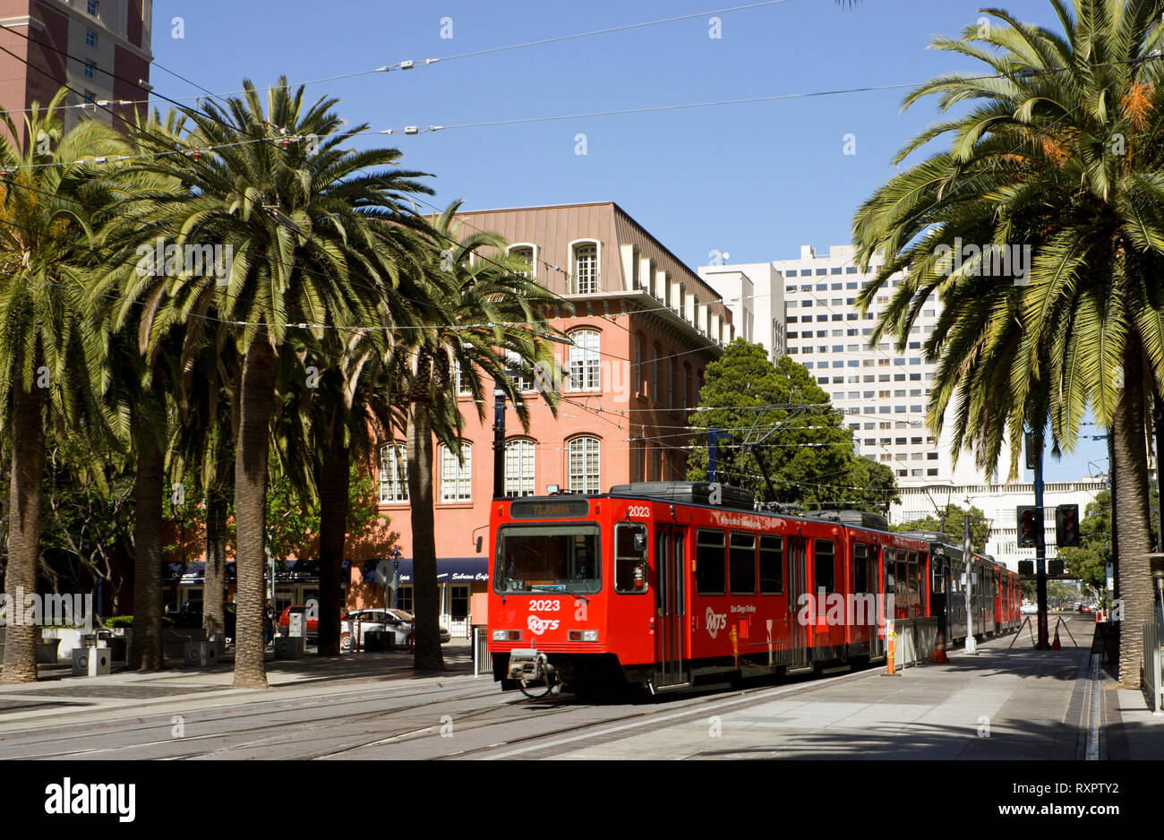 The trolley of the orange line rolls along the central street San Diego ...