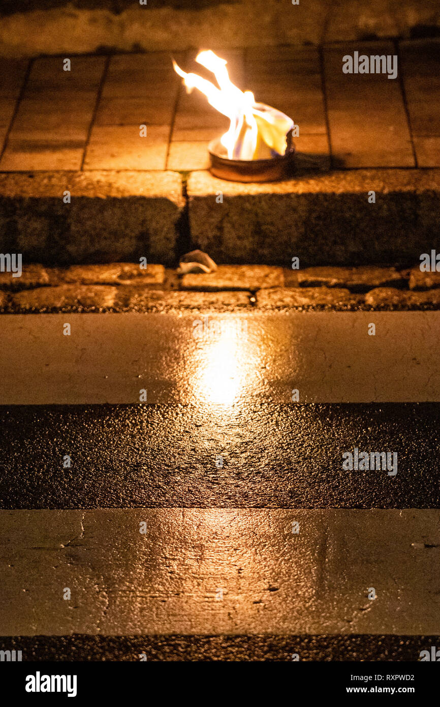 small fire reflecting on zebra crossing Stock Photo - Alamy