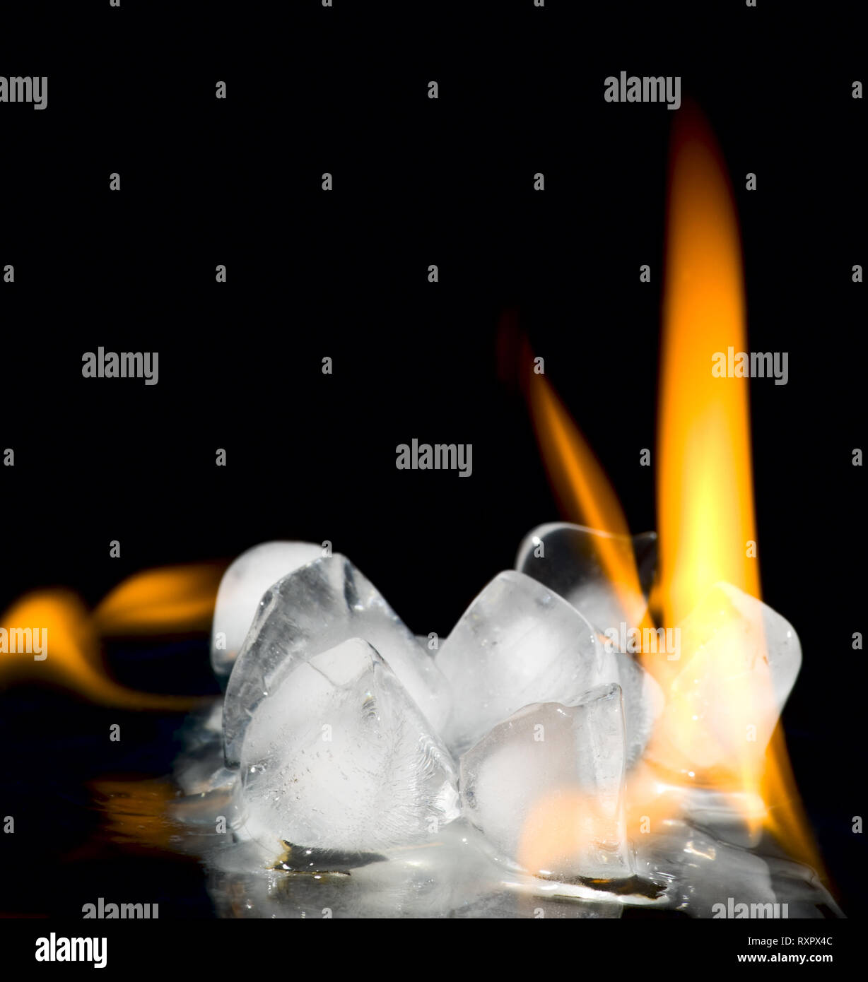 Burning stack of ice on black background Stock Photo - Alamy