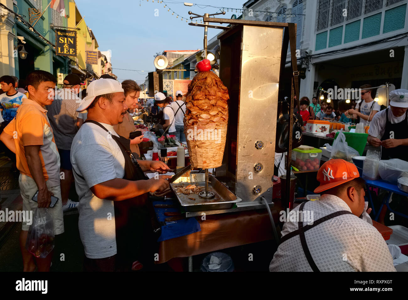 A Muslim food vendor in the weekly Walking Street market in Thalang ...