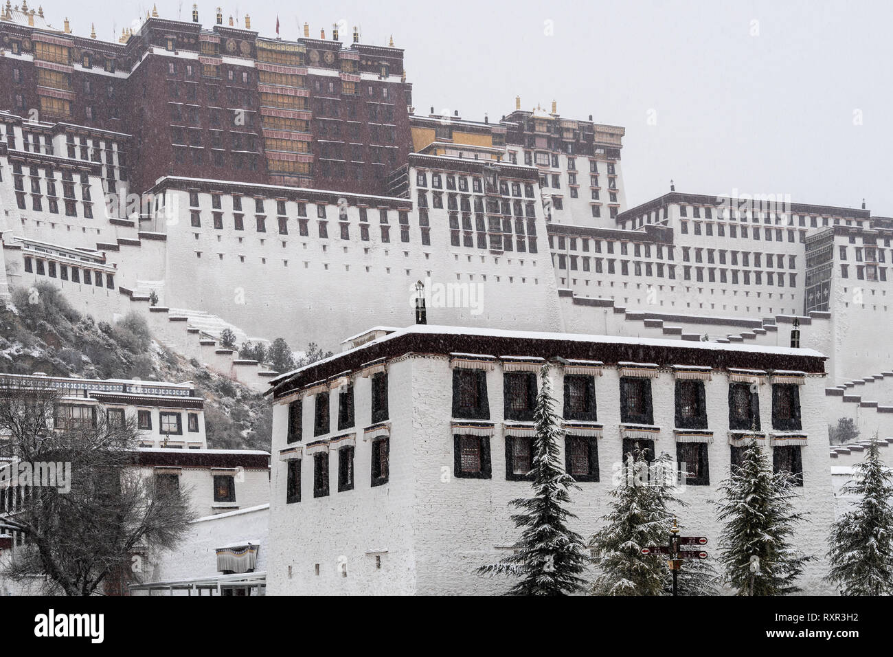 Snow falling on the famous Potala Palace in Lhasa in Tibet capital city ...
