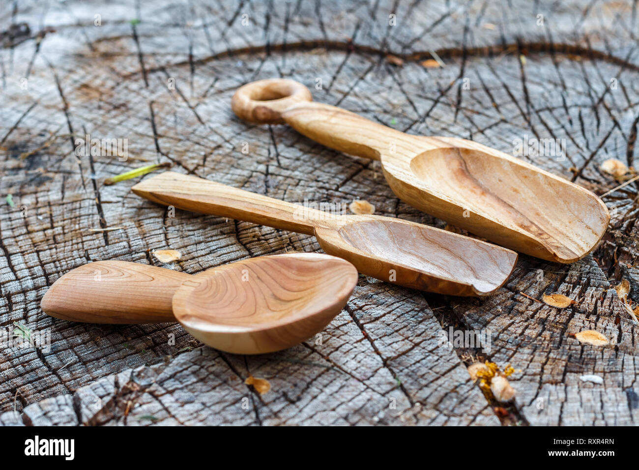 Handmade rustic wooden spoons from beautiful wood on a stump Stock ...