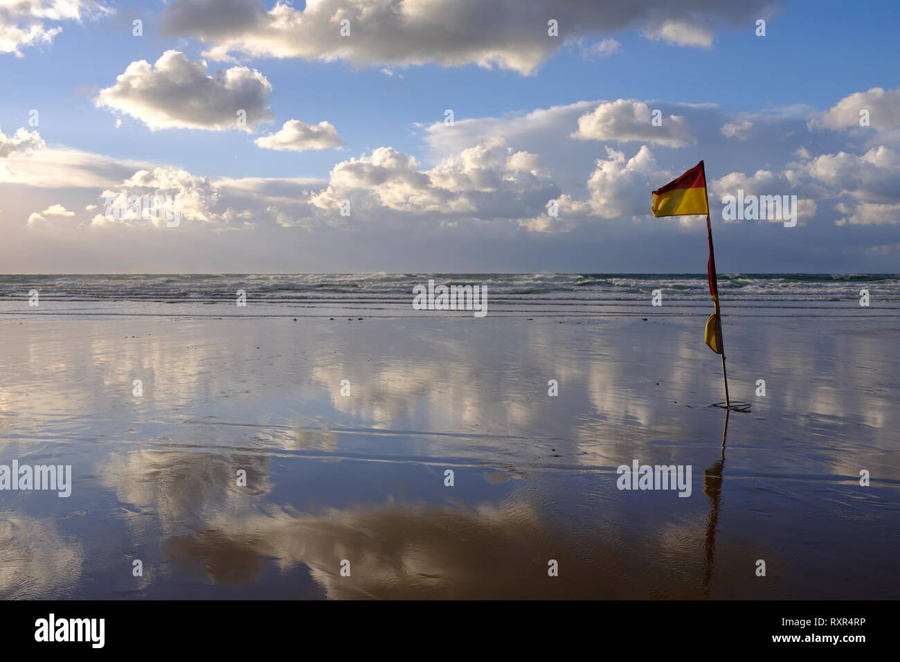 RNLI Flags Red and Yellow with dramatic sky Stock Photo - Alamy