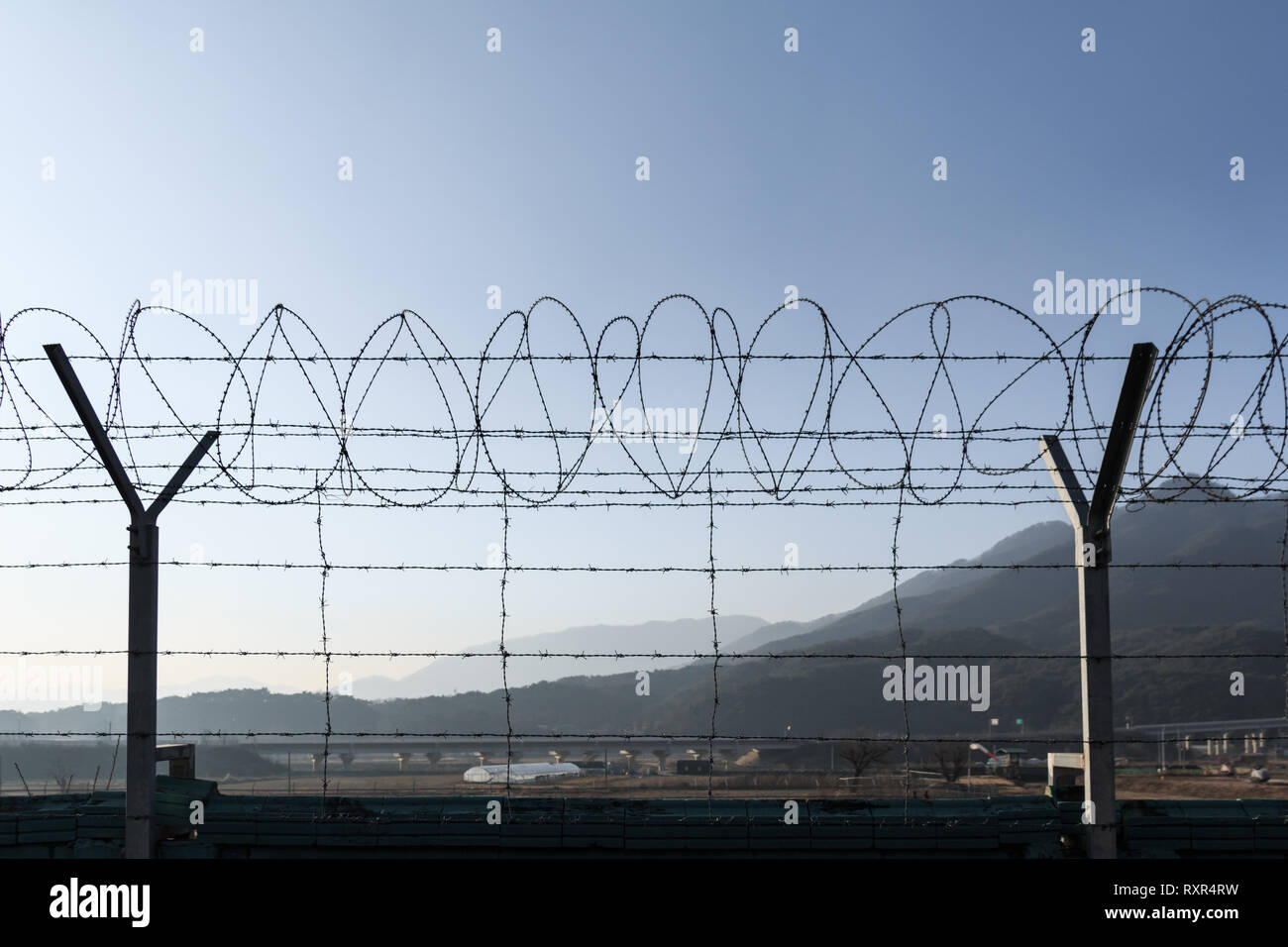 barbed wire, steel fencing wire with sharp edge or points Stock Photo ...