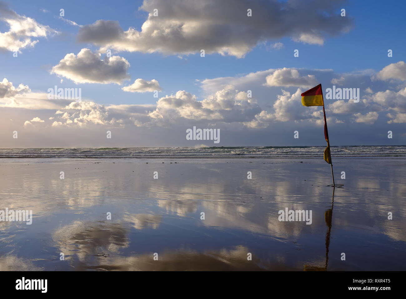RNLI Flags Red and Yellow with dramatic sky Stock Photo - Alamy