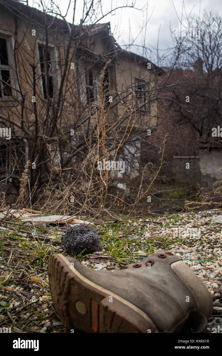 Abandoned old houses, clothes thrown into the street Stock Photo - Alamy